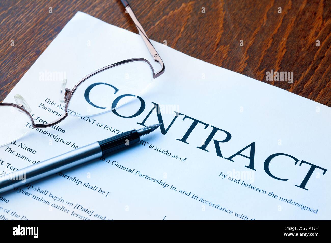 Pen and contract papers on wooden desk Stock Photo - Alamy