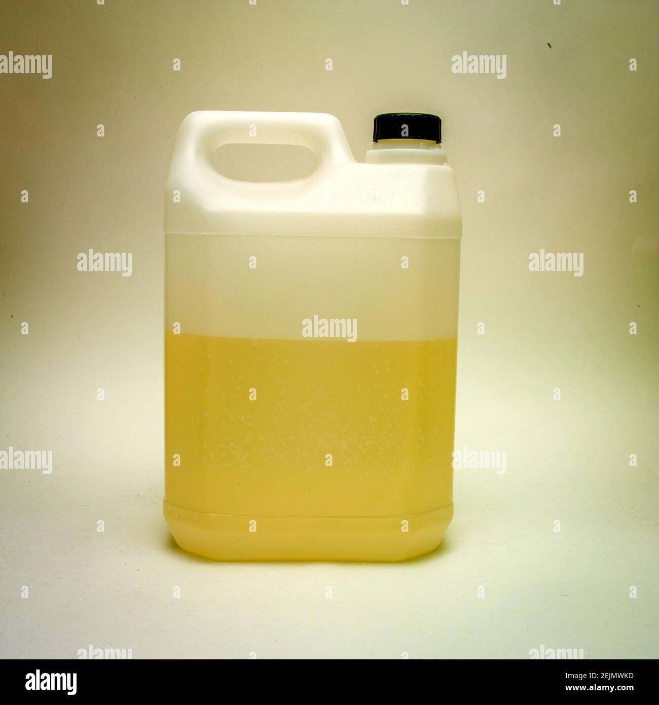 Plastic jug filled with yellow liquid Stock Photo - Alamy