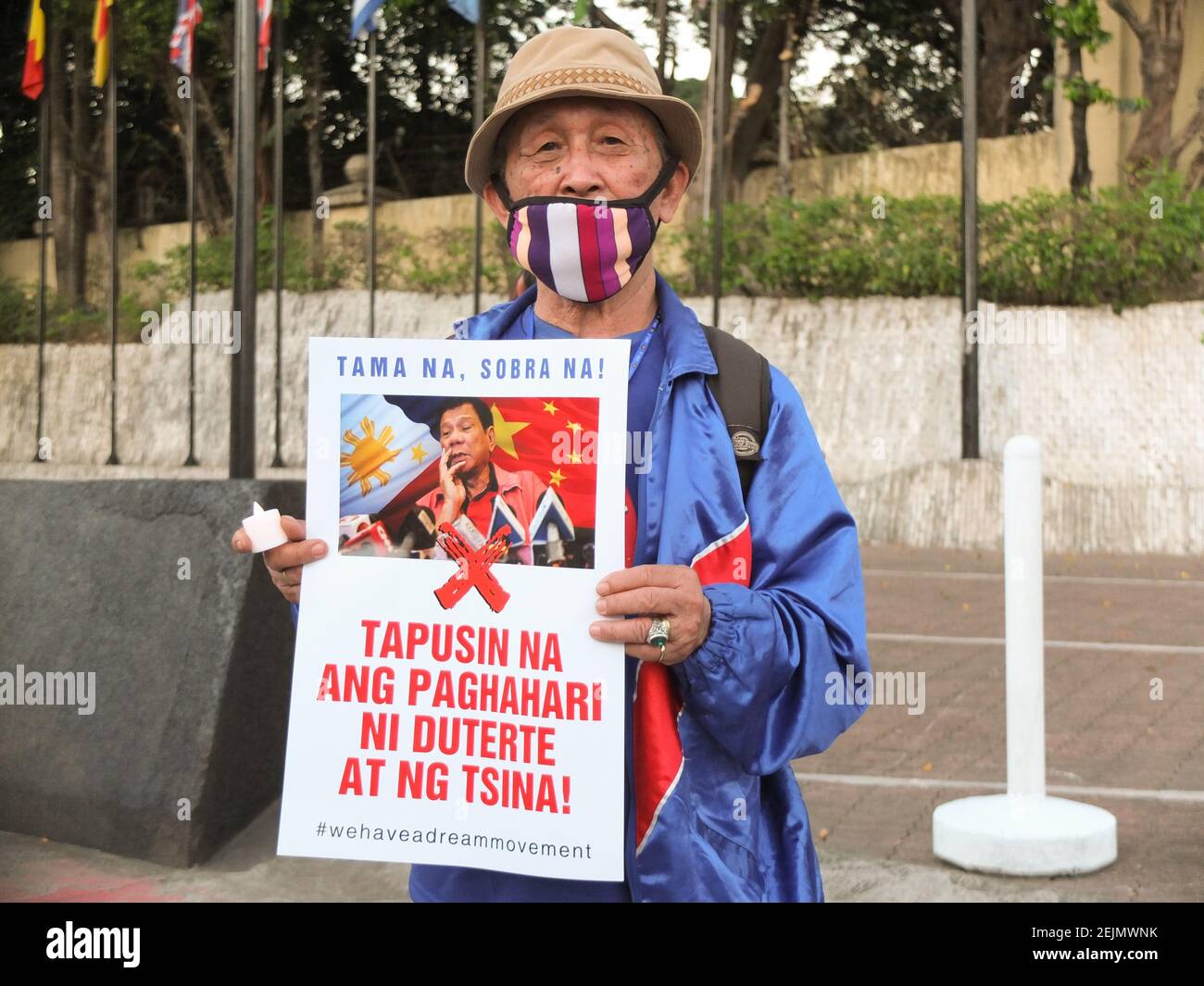 A protester holds a placard during the demonstration. Members of ...