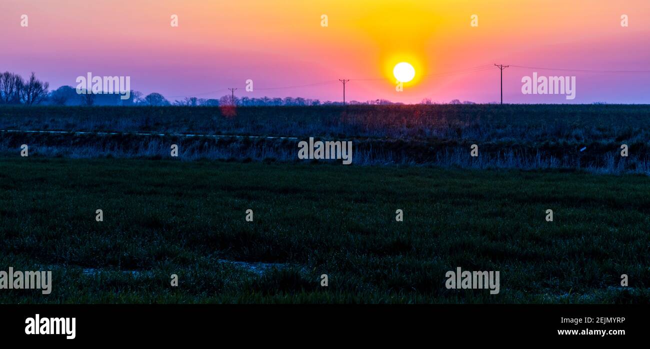 Beautiful sunrise at morning over huge green fields Stock Photo - Alamy
