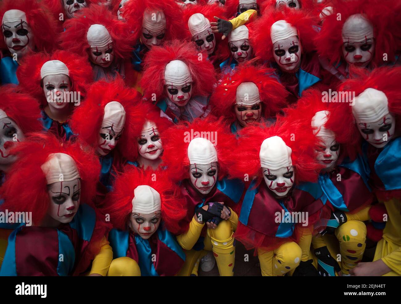 A group of dancers dressed as clowns pose for a photo before the ...