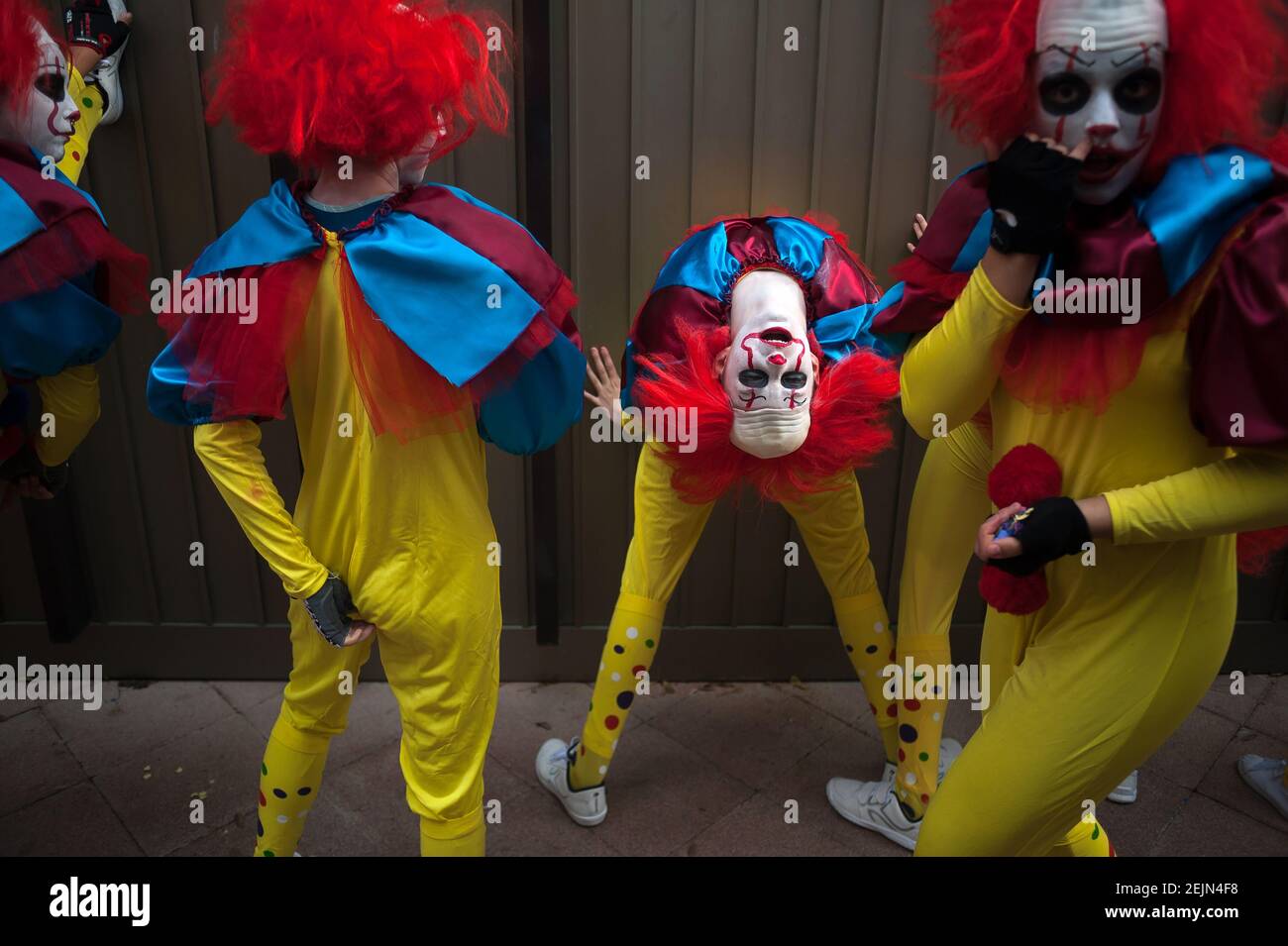 A group of dancers dressed as clowns rehearsal before the traditional ...