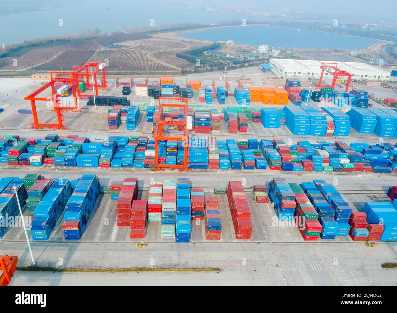 An aerial view of containers and cranes at an export port in Rugao ...