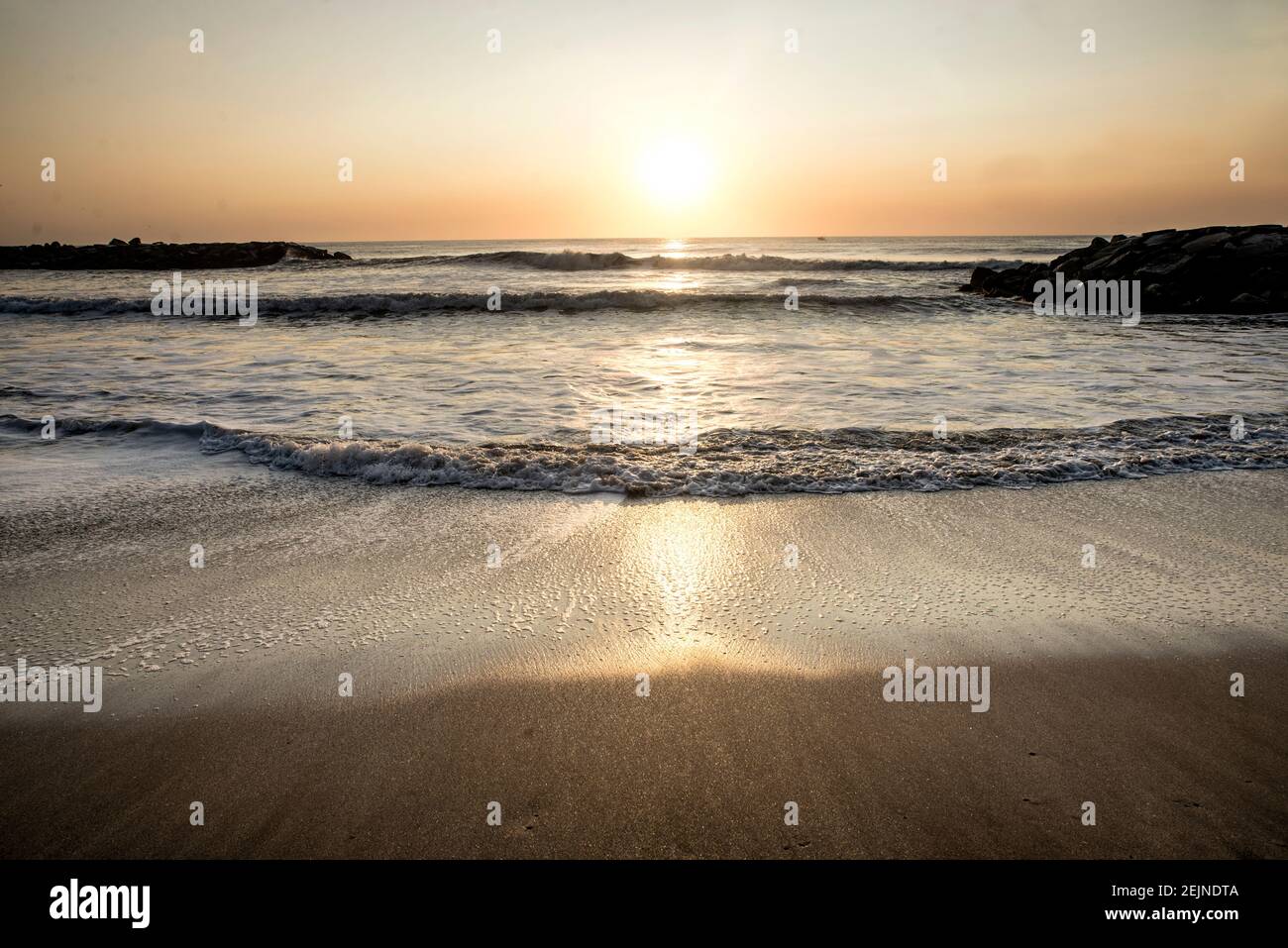 sunset marine landscape Waves on the beach Stock Photo - Alamy
