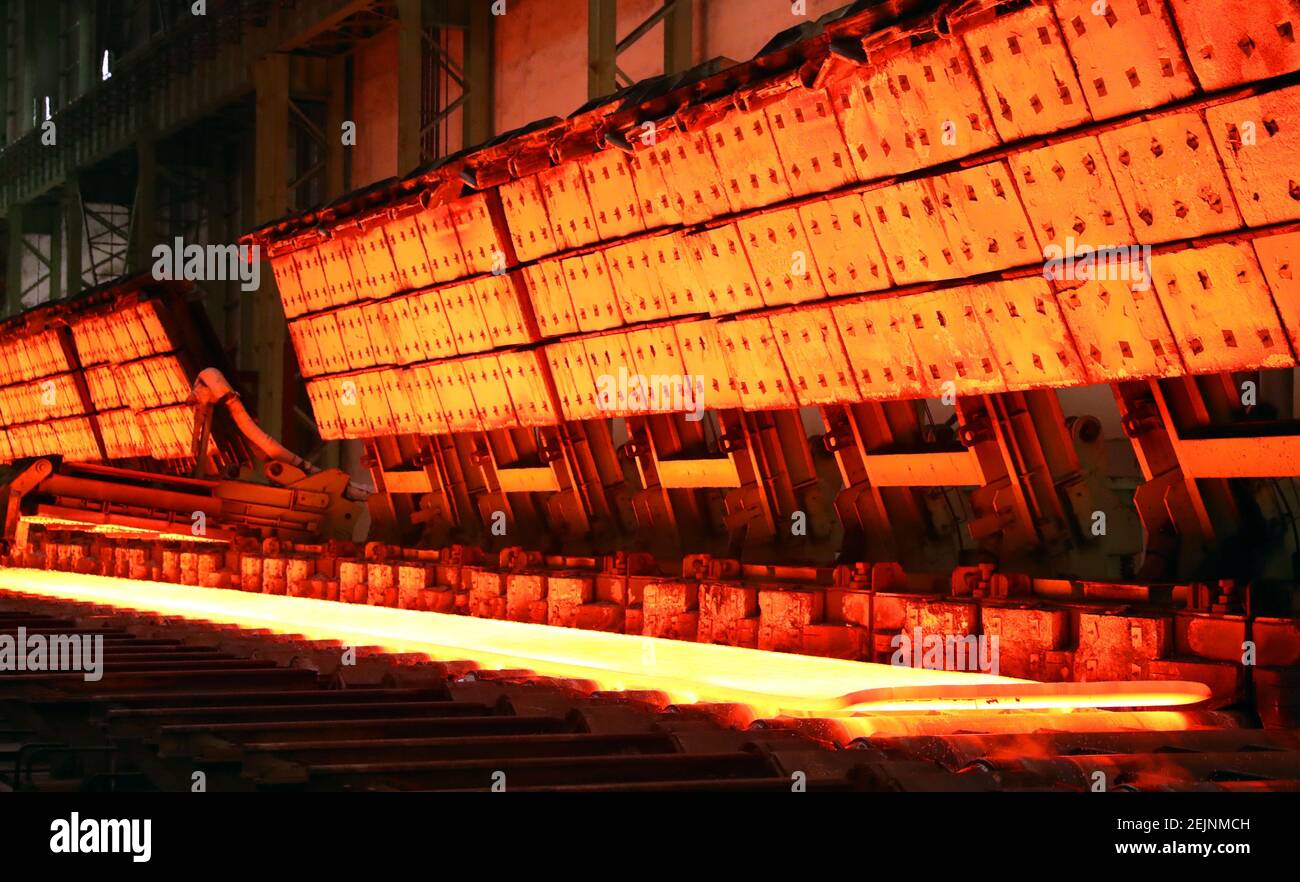 The workers are observing the steel in the steelmaking workshop. (Photo ...