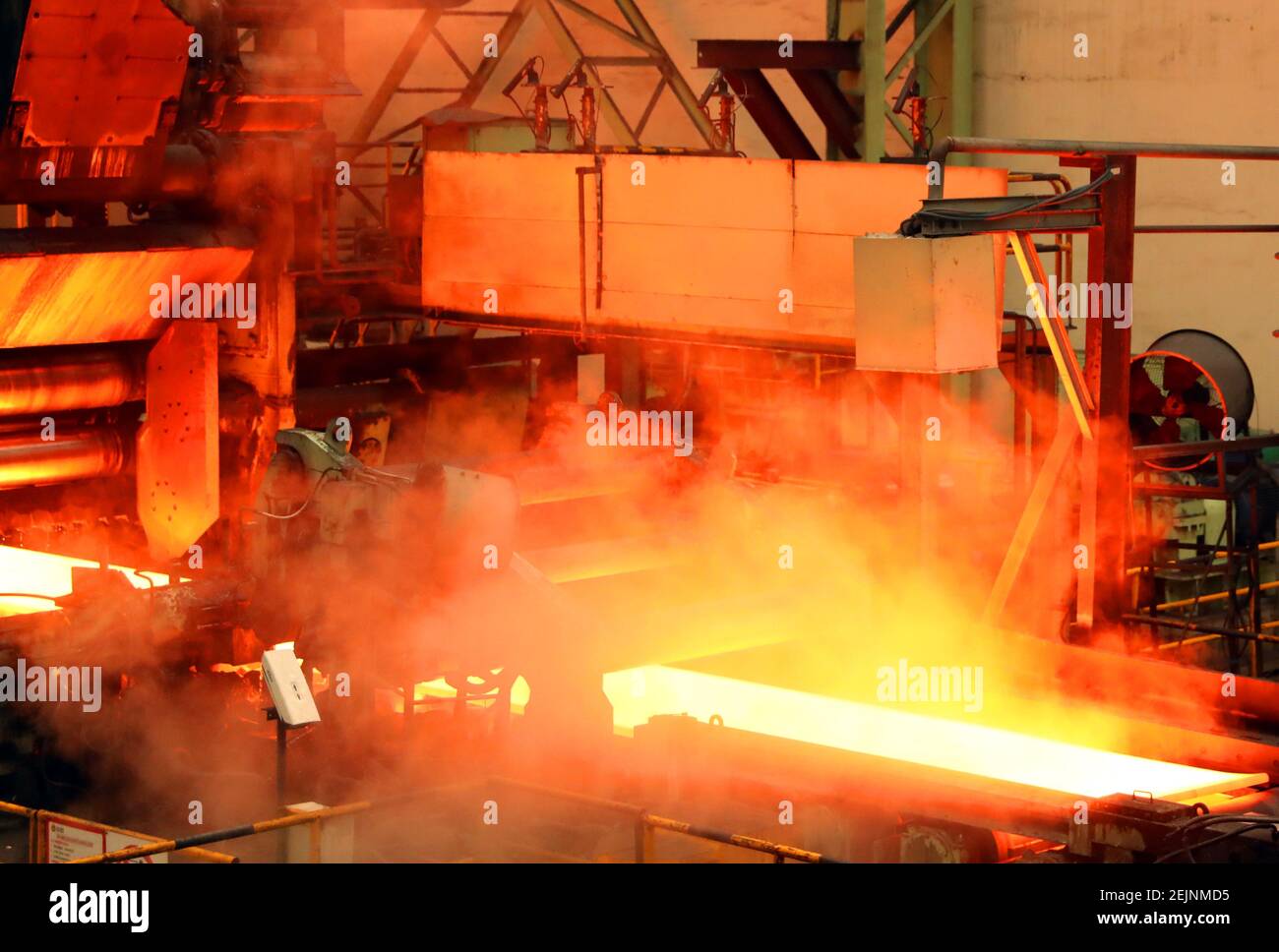 The workers are observing the steel in the steelmaking workshop. (Photo ...