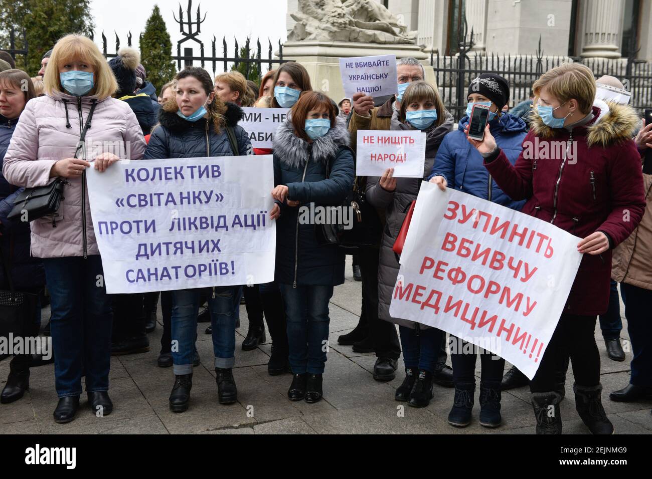 Protesters hold placards during the demonstration. Doctors protest ...