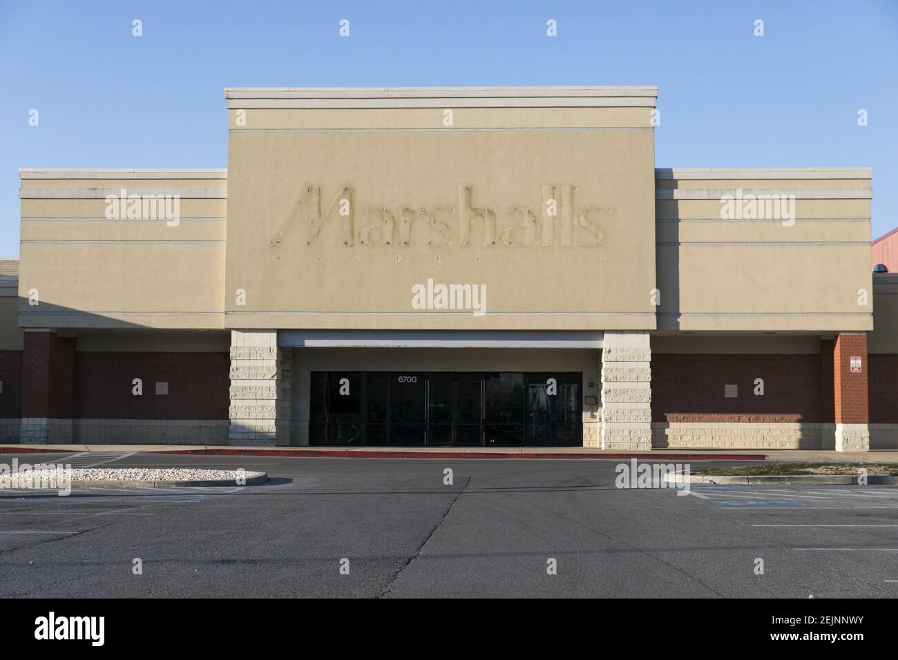 A the faded outline of a Marshalls logo sign outside of a closed retail ...