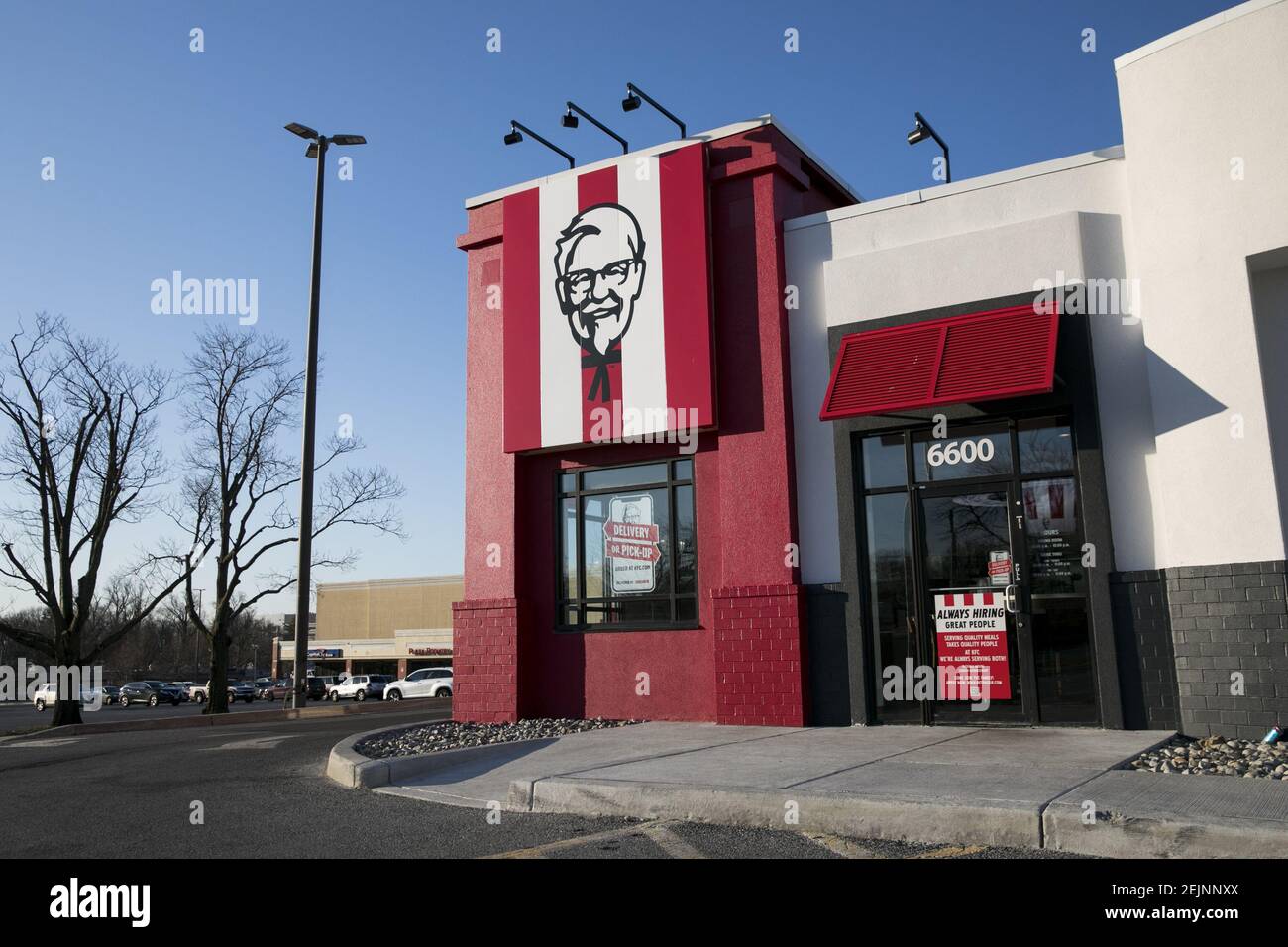A logo sign outside of a Kentucky Fried Chicken (KFC) fast food ...