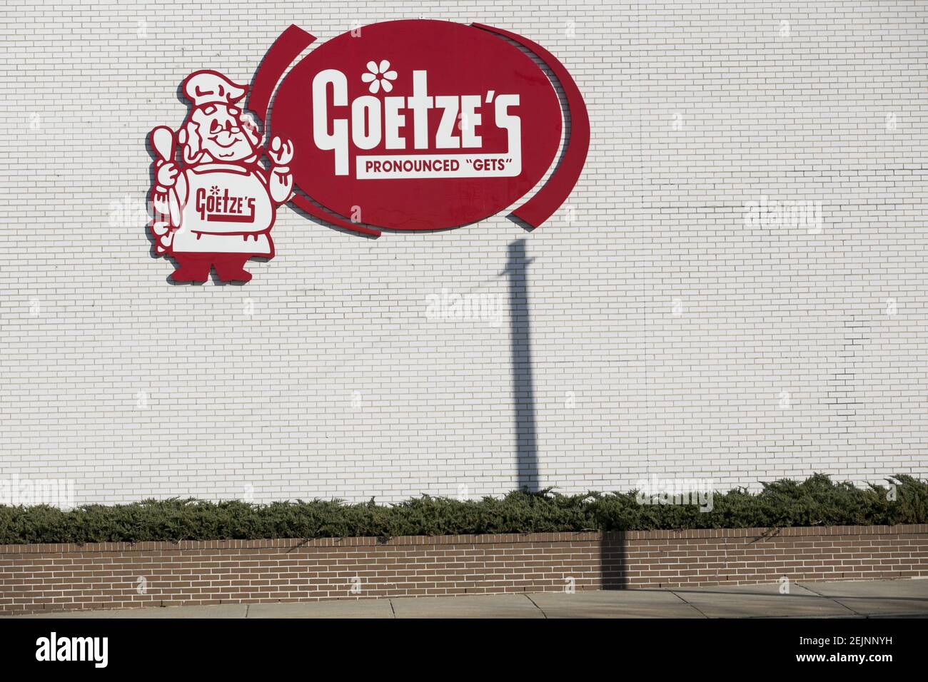 A logo sign outside of the headquarters and factory of the Goetze's ...