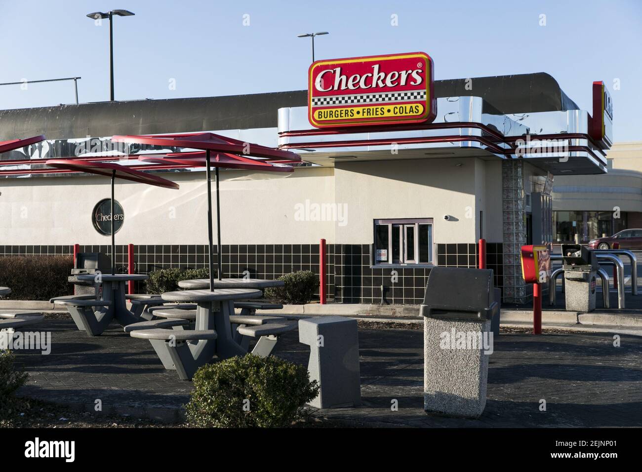 A logo sign outside of a Checkers fast food restaurant location in ...