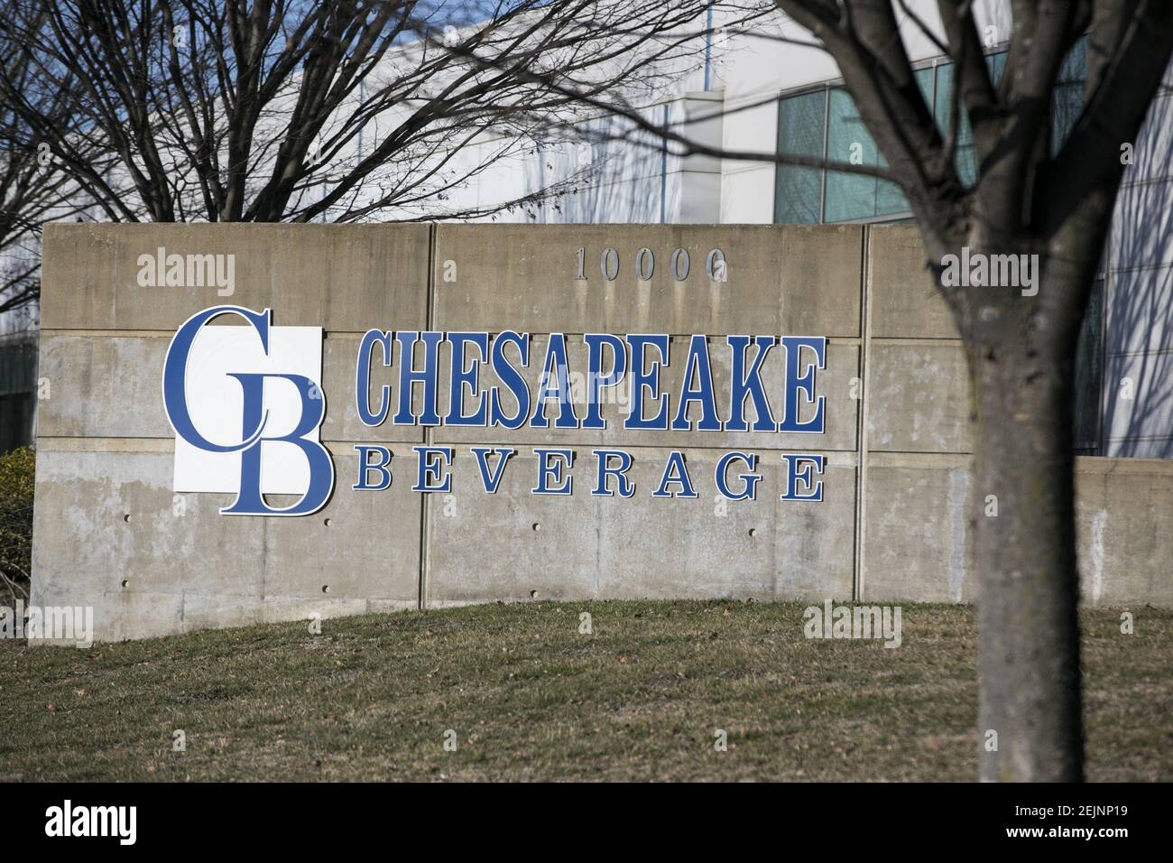 A logo sign outside of a facility occupied by Chesapeake Beverage in ...