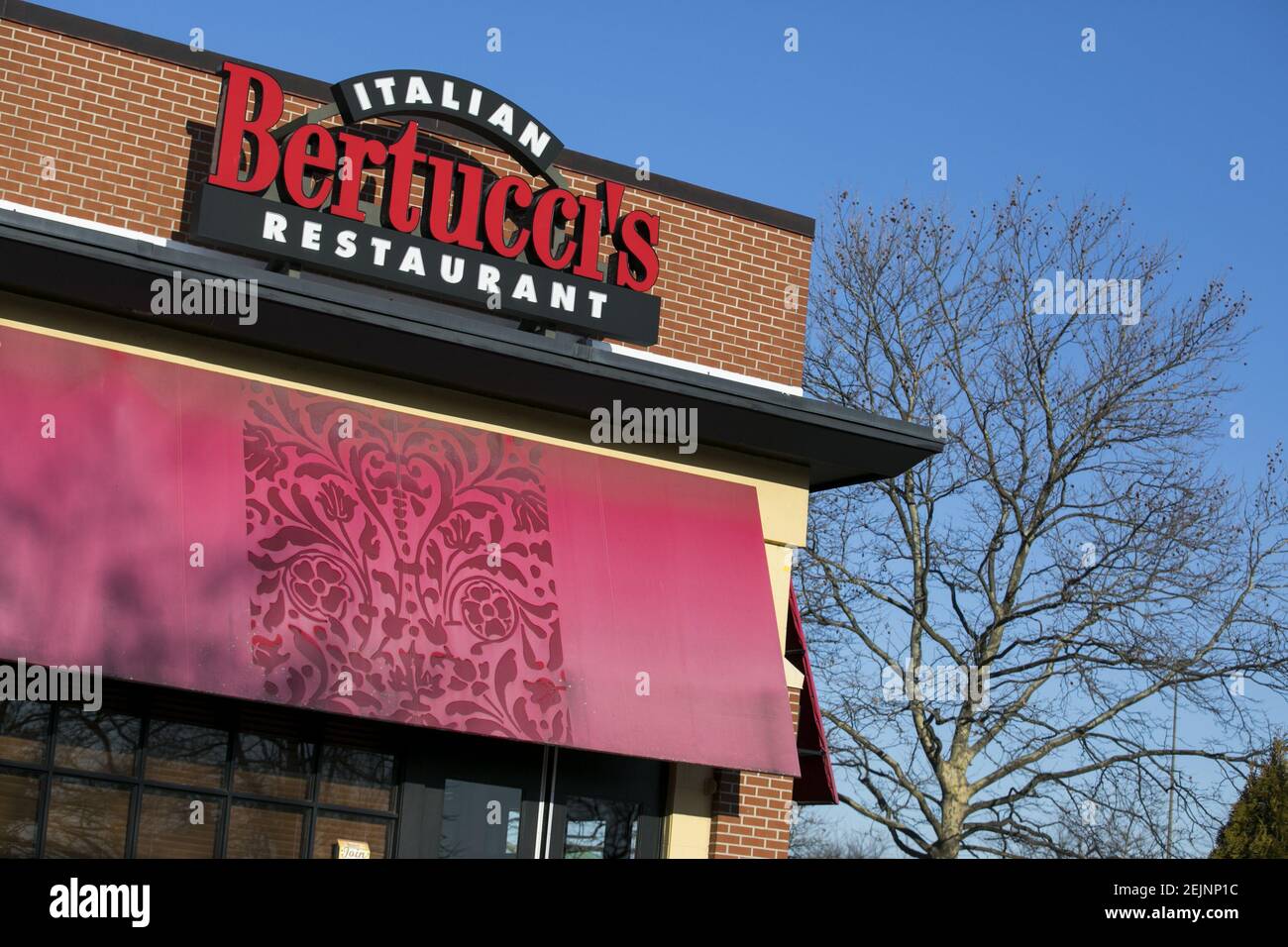A logo sign outside of Bertucci's restaurant location in Baltimore ...