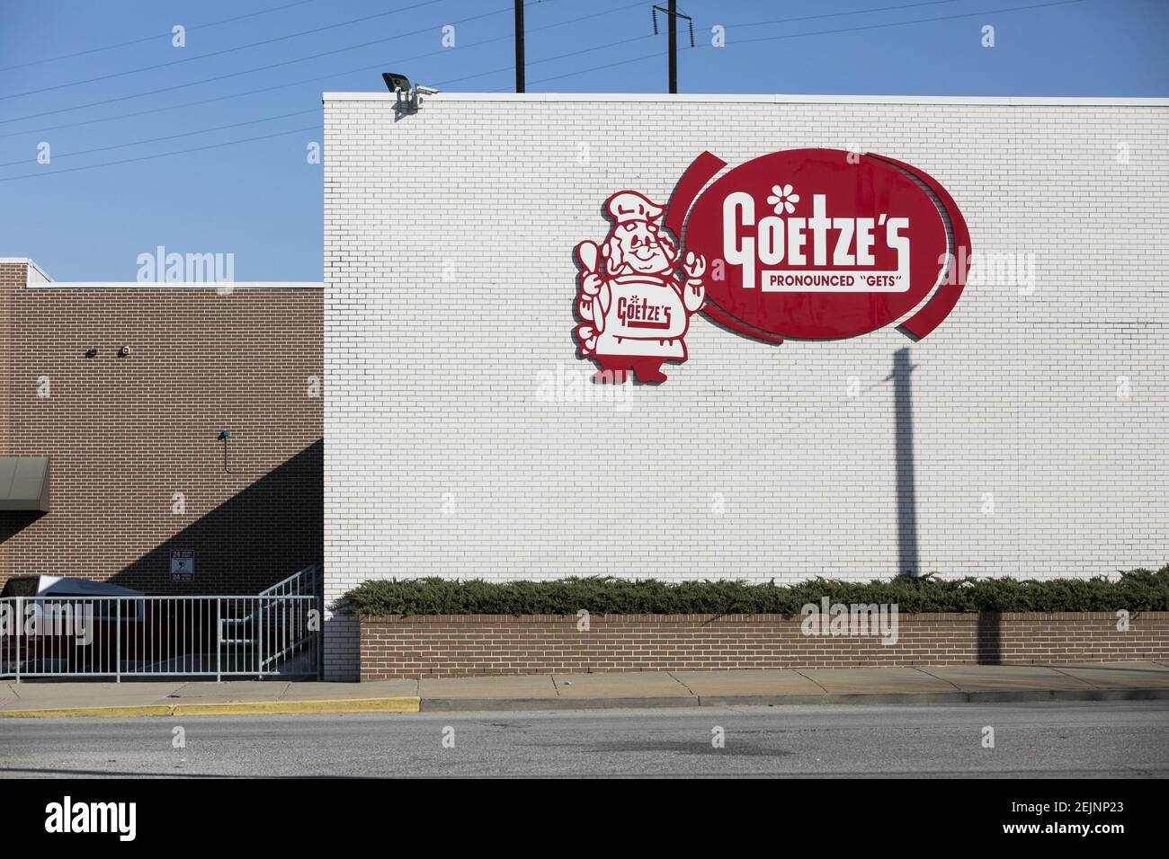 A logo sign outside of the headquarters and factory of the Goetze's ...