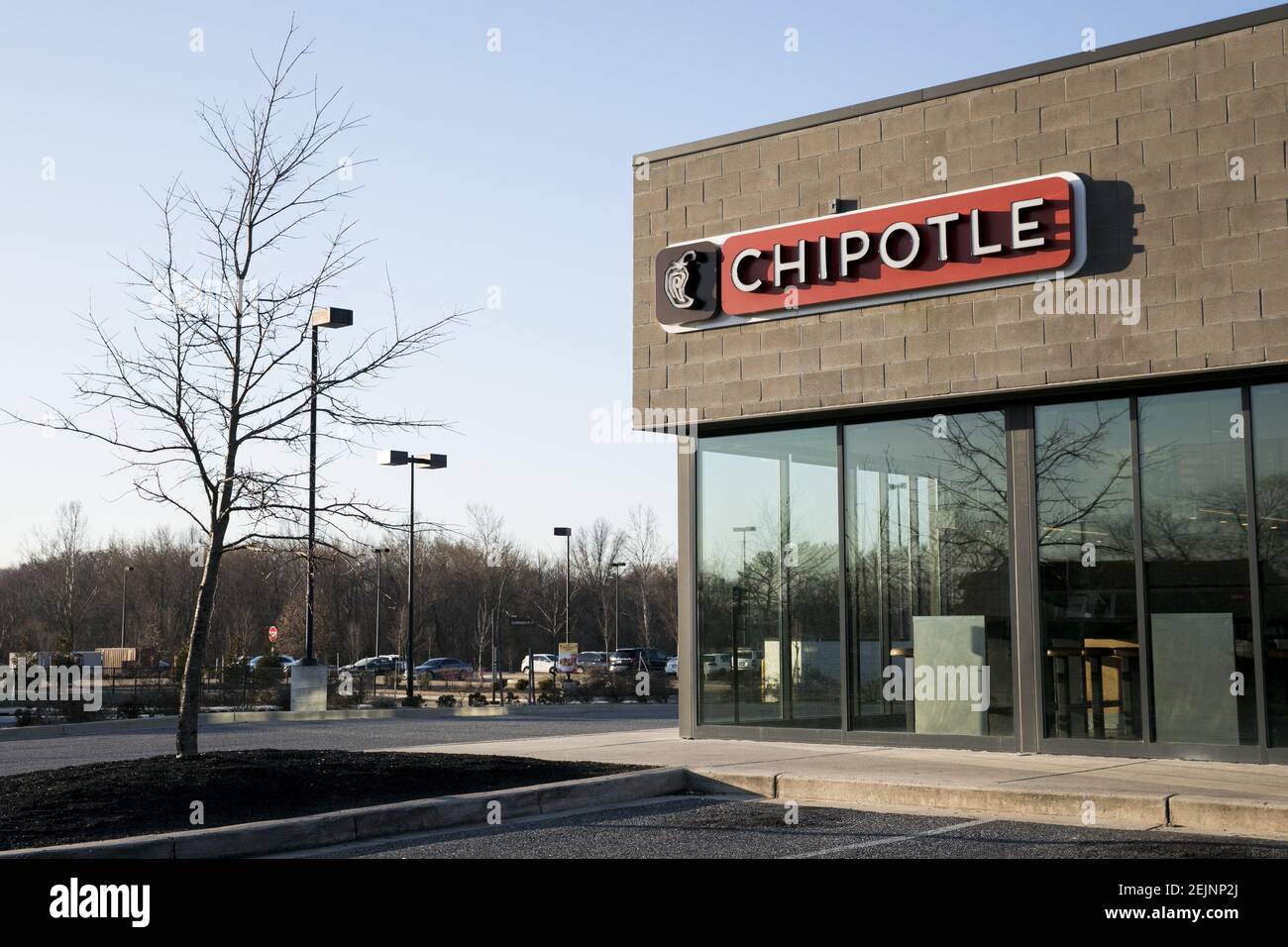 A logo sign outside of a Chipotle restaurant location in Nottingham ...
