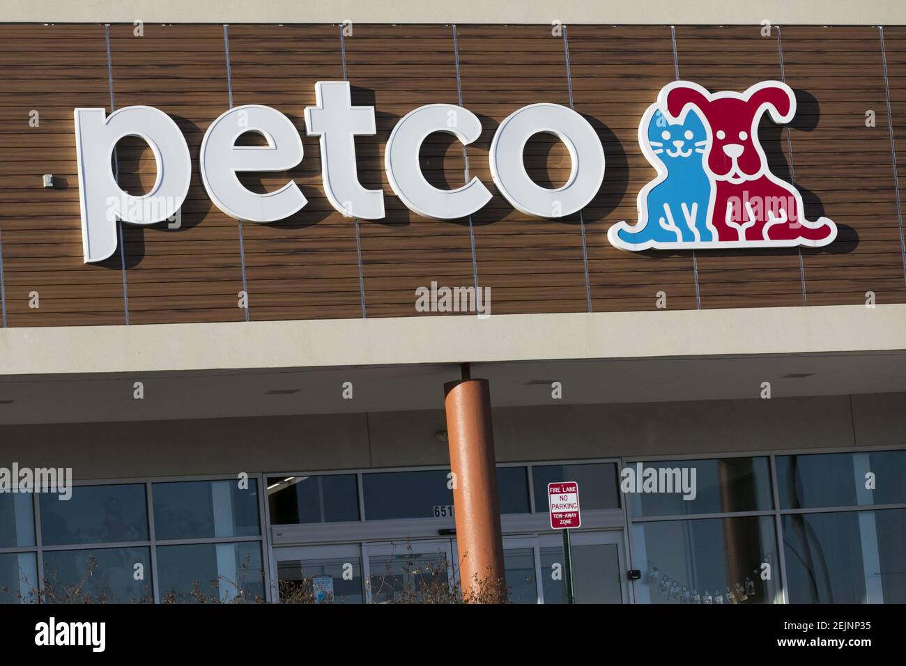 A logo sign outside of a Petco retail store location in Baltimore ...