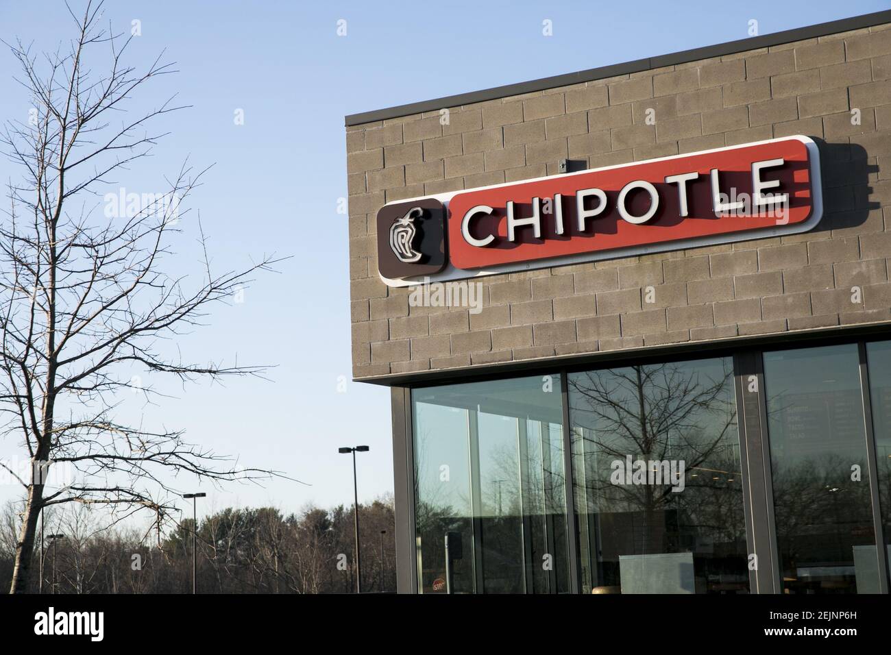 A logo sign outside of a Chipotle restaurant location in Nottingham ...