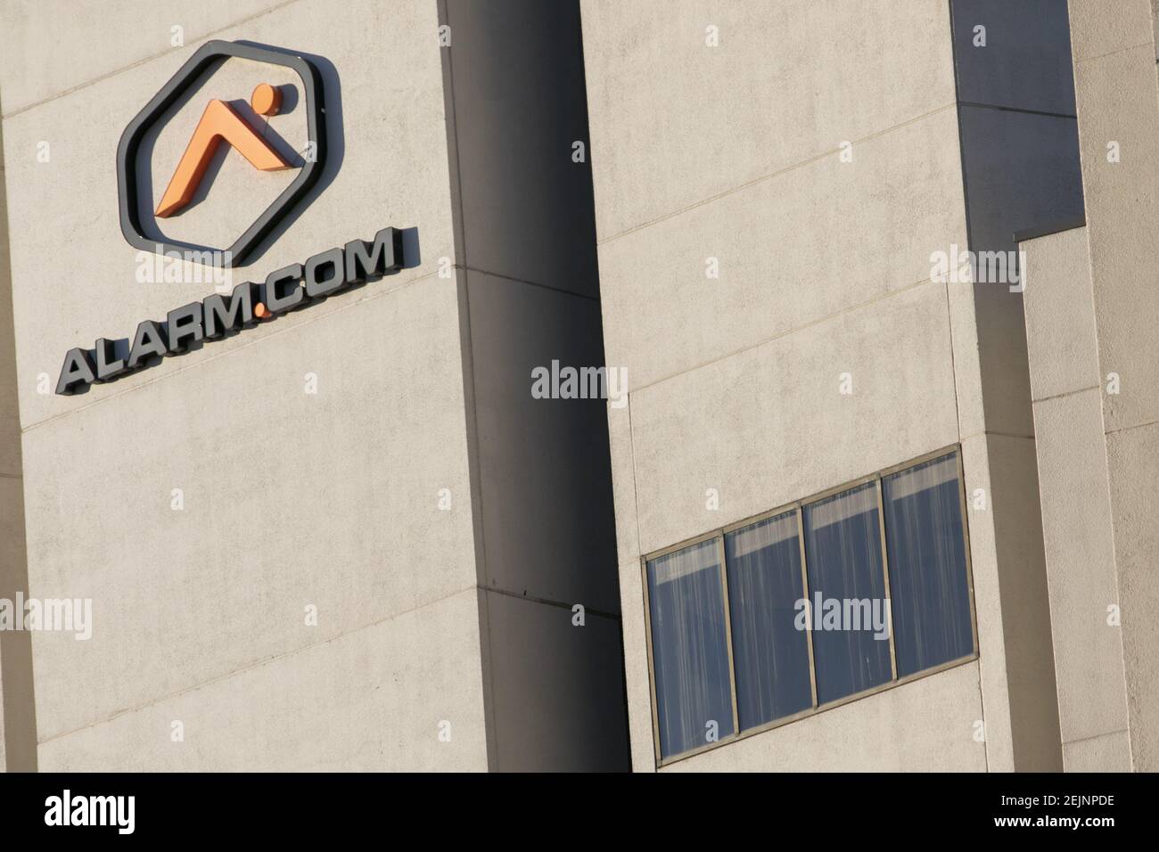 A logo sign outside of the headquarters of Alarm.com in McLean ...