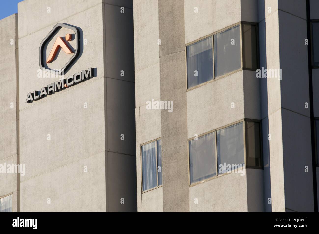 A logo sign outside of the headquarters of Alarm.com in McLean ...