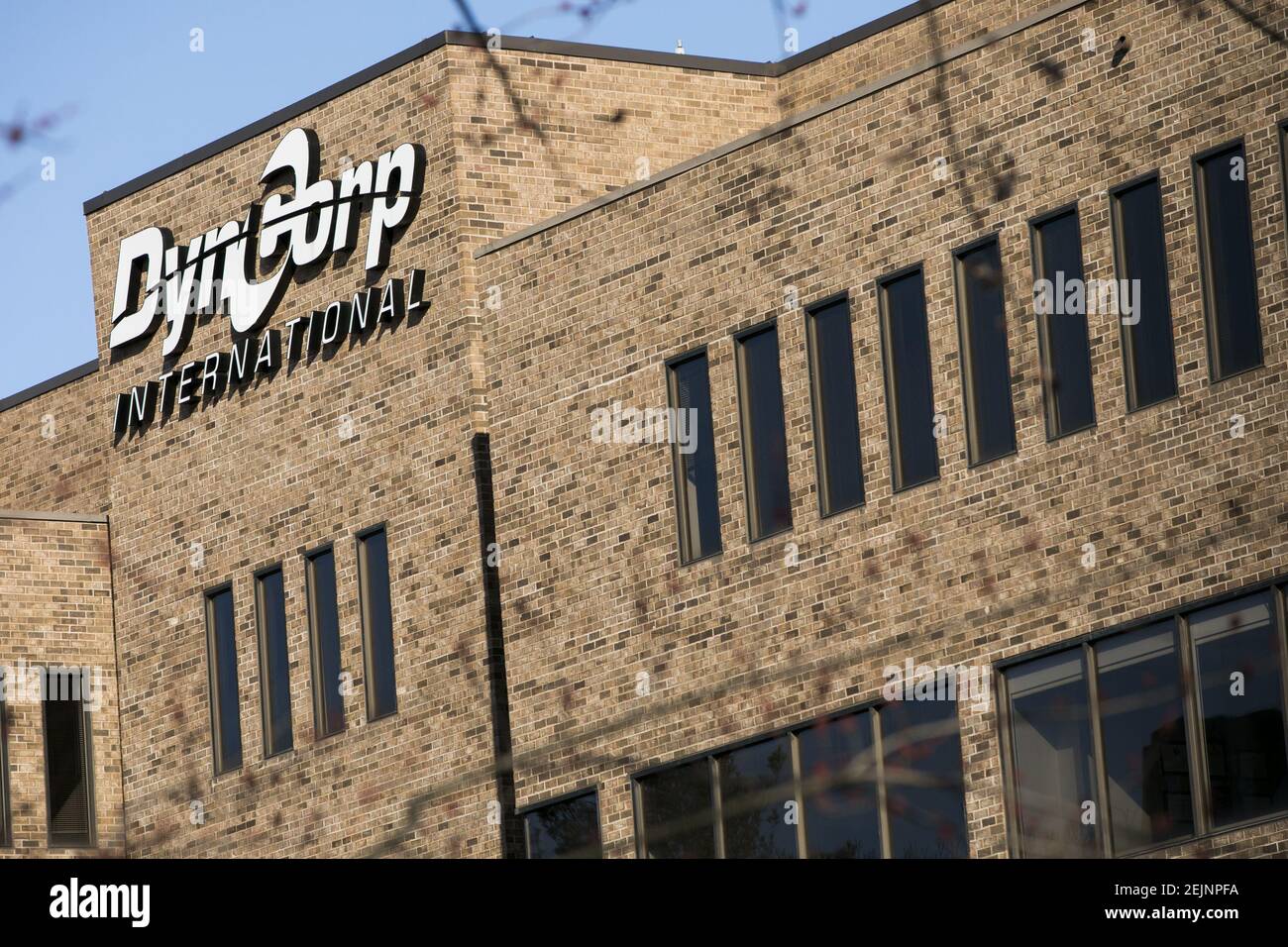 A logo sign outside of a facility occupied by DynCorp in McLean ...