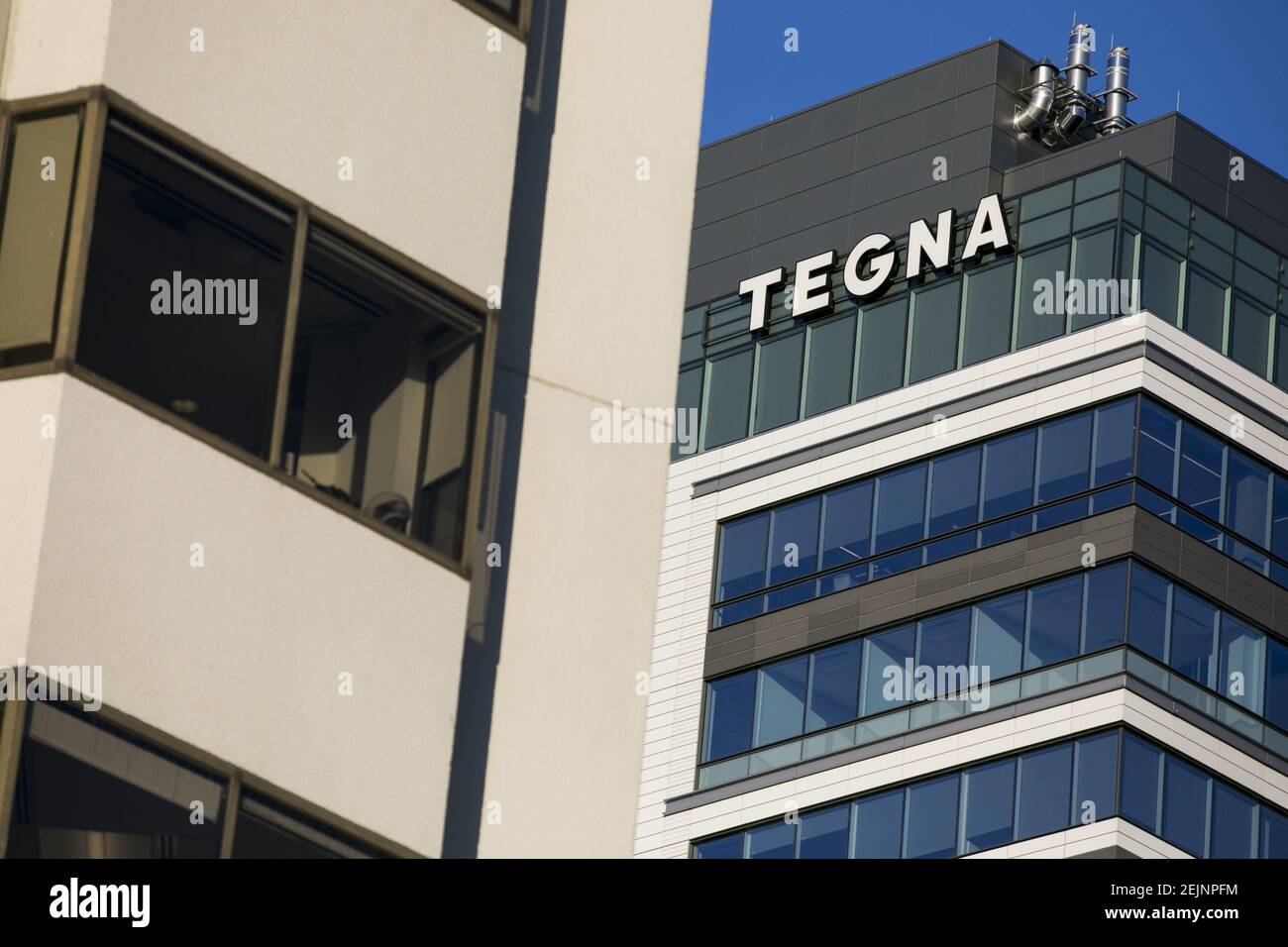 A logo sign outside of the headquarters of Tegna in McLean, Virginia ...