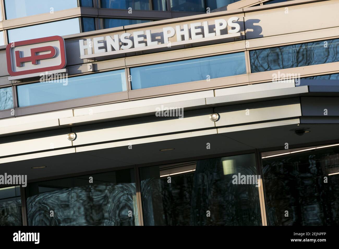 A logo sign outside of a facility occupied by Hensel Phelps in McLean ...