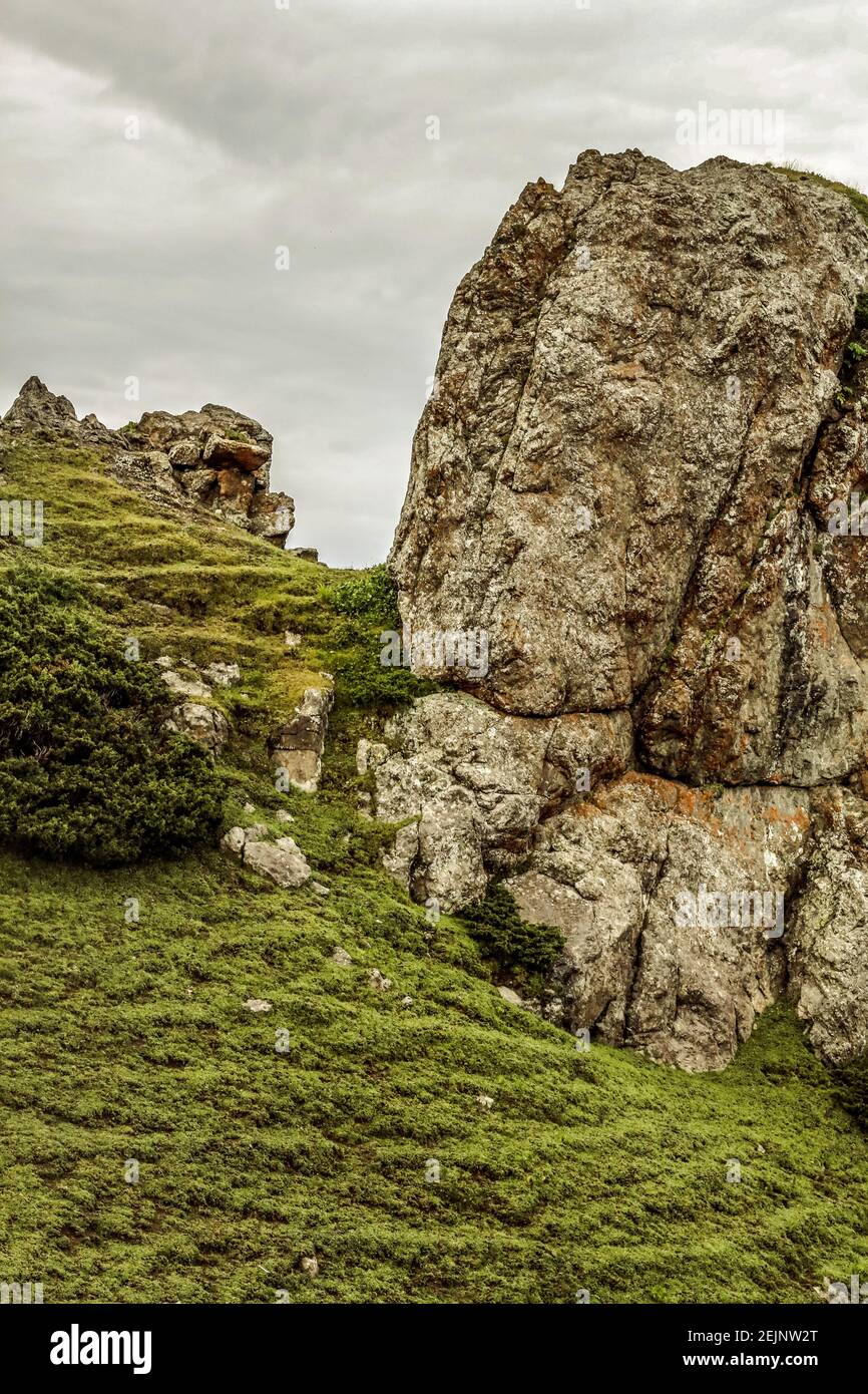 Natural view of a huge rock in the grassy hill in Kumrat Valley ...