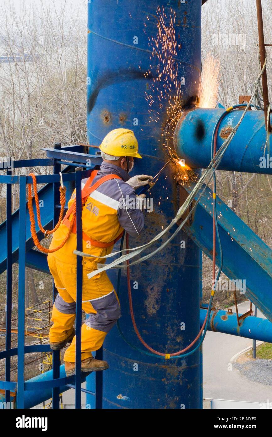 Jiangsu,CHINA-Construction workers work on the construction site of the ...