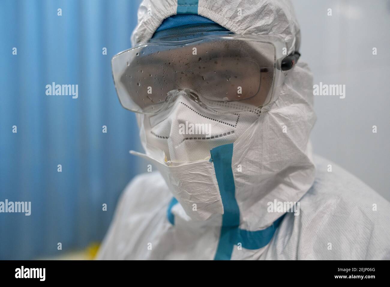 A well-protected Chinese medical worker is on duty at a hospital in ...