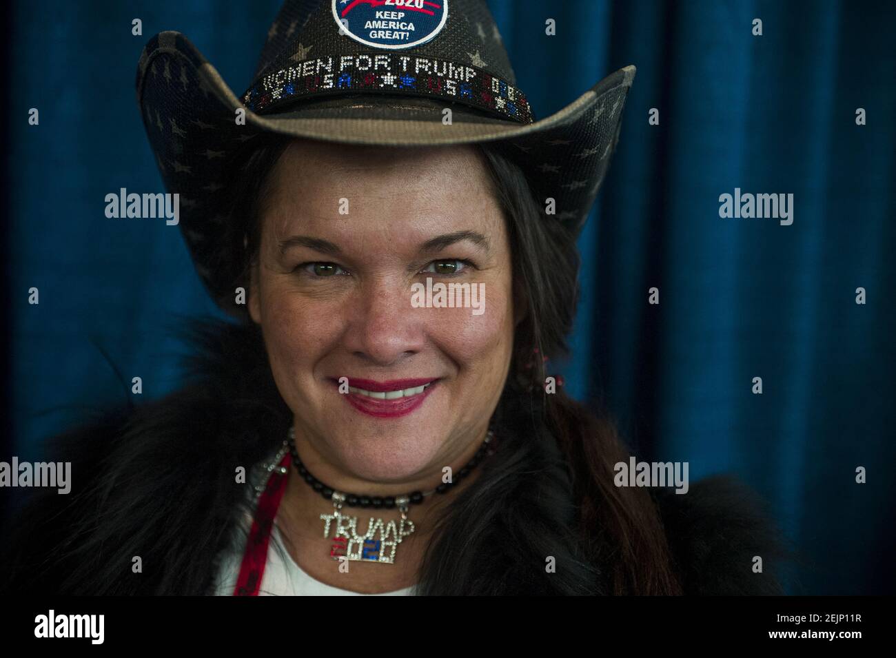 President Trump supporter Priscilla Confrey takes a moment for a ...