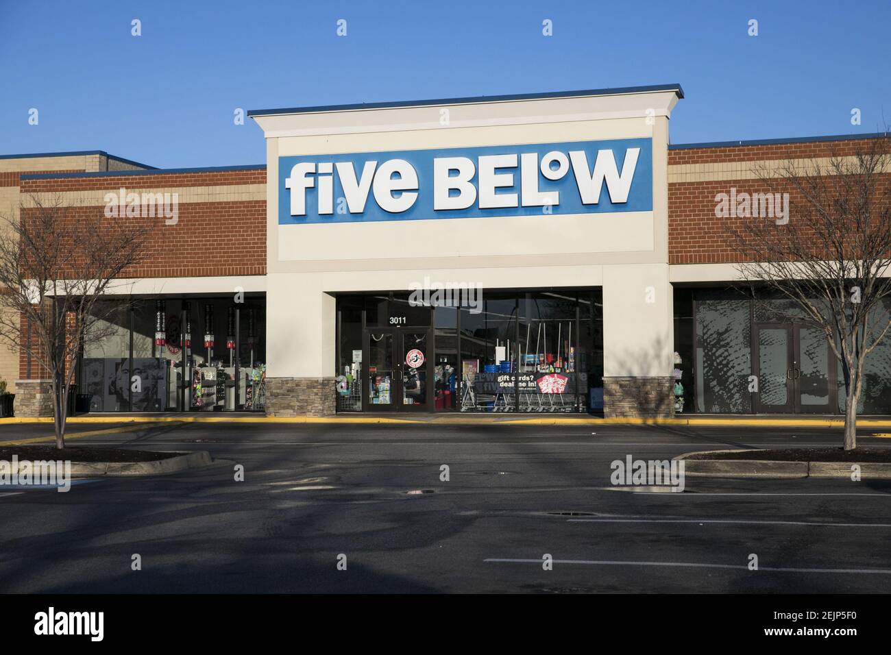 A logo sign outside of a Five Below retail store location in Waldorf ...