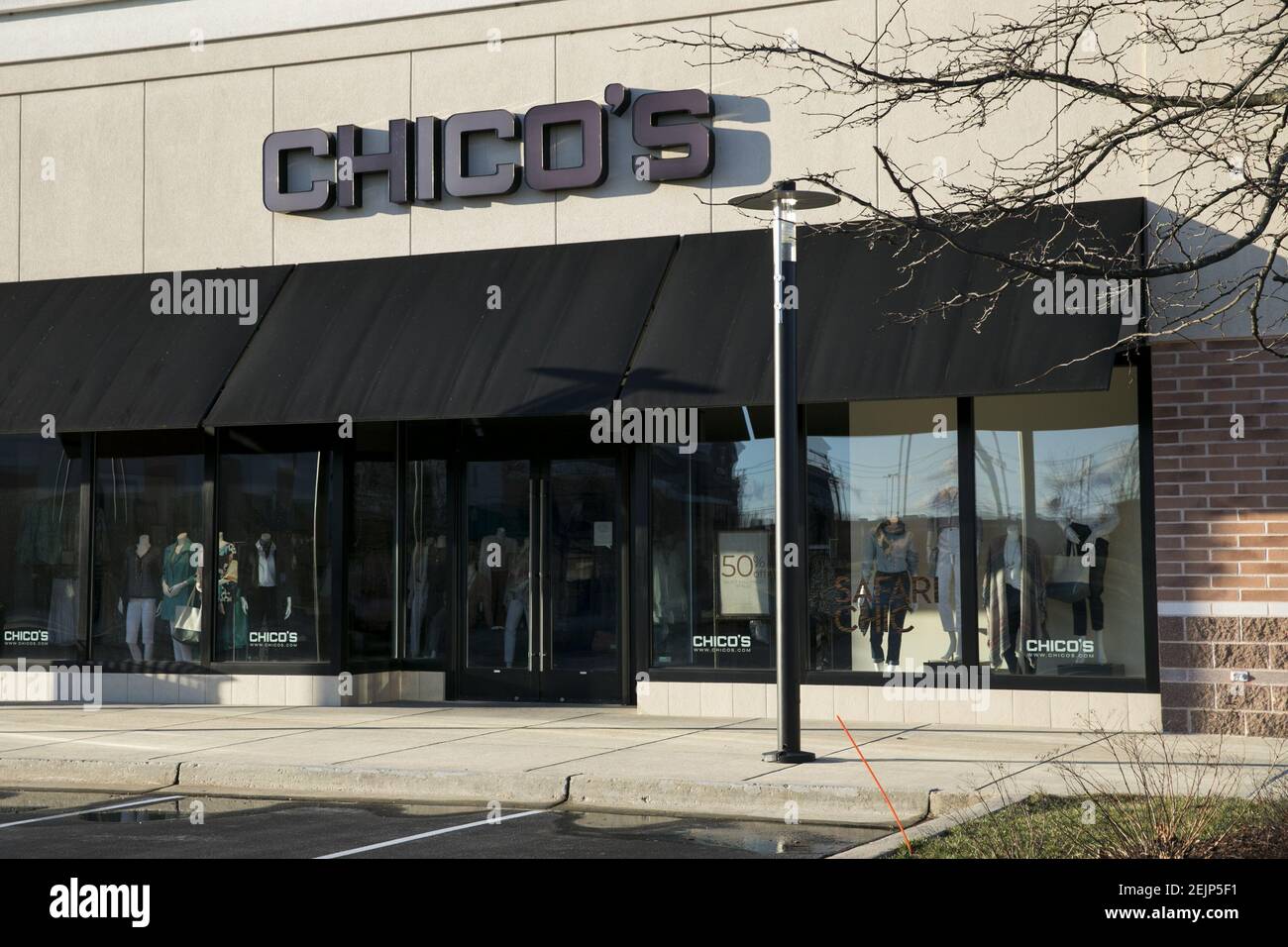 A logo sign outside of a Chico's retail store location in Waldorf ...
