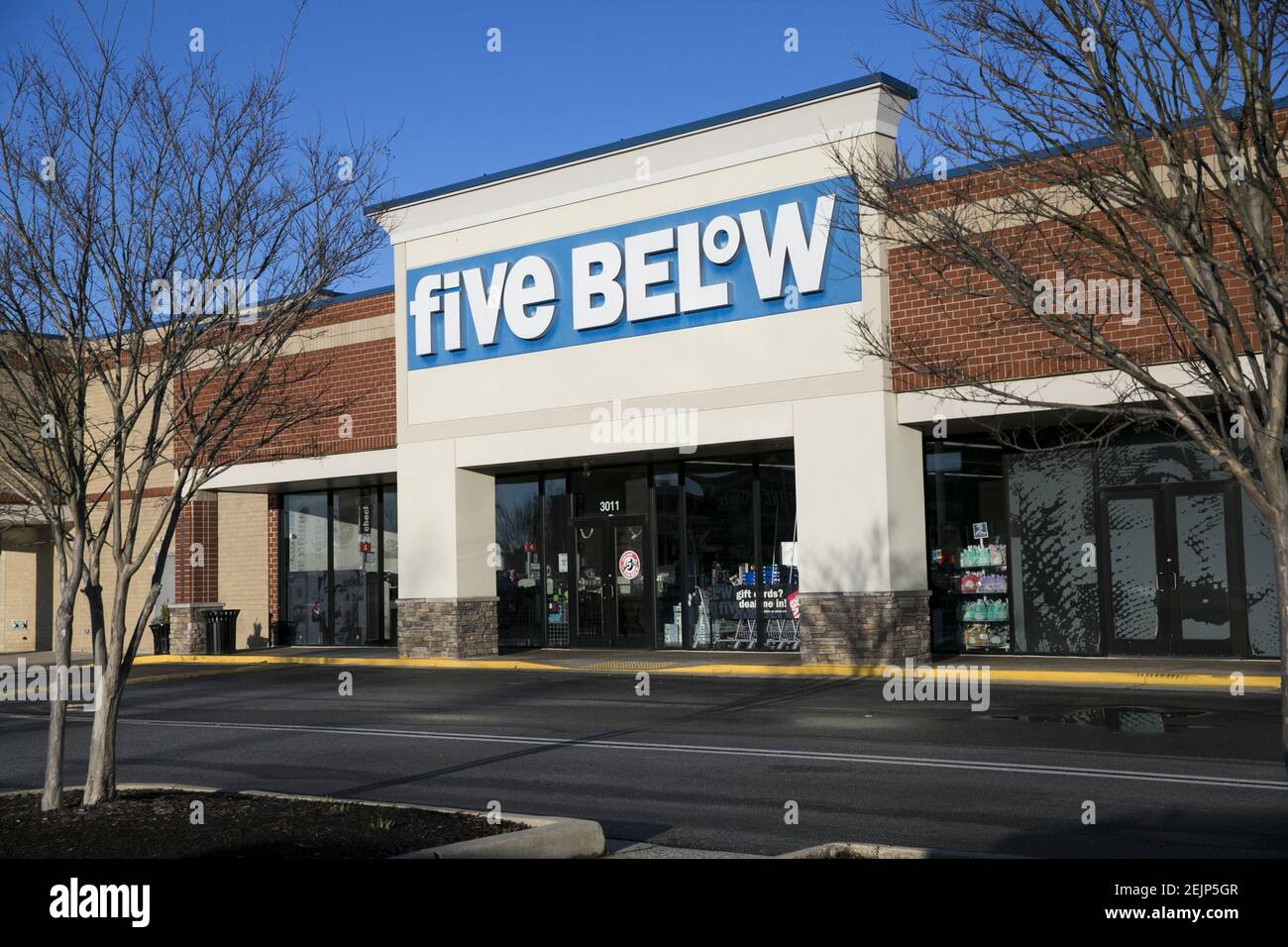 A logo sign outside of a Five Below retail store location in Waldorf ...
