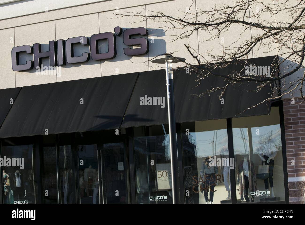 A logo sign outside of a Chico's retail store location in Waldorf ...