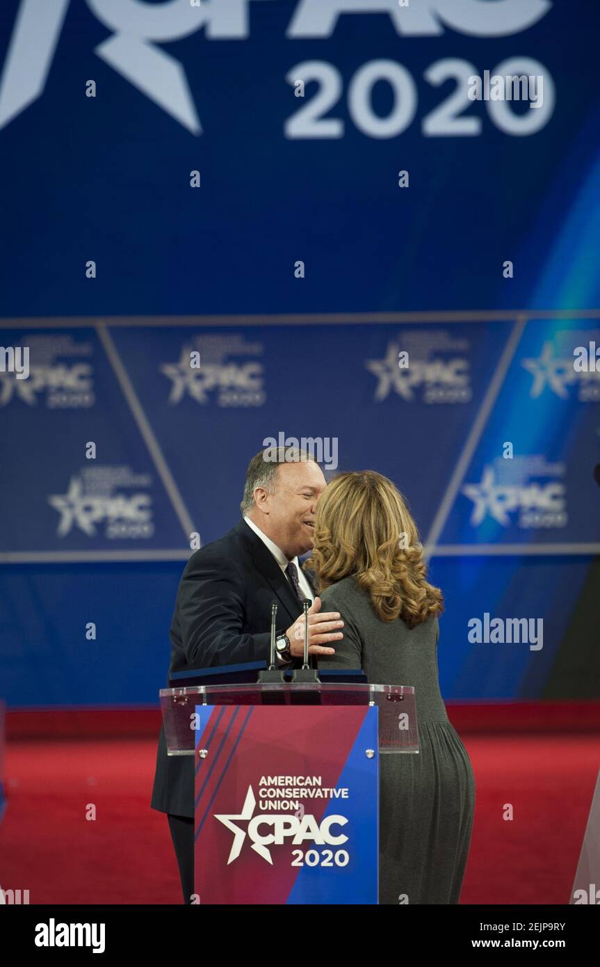 Secretary of State Mike Pompeo kisses his wife Susan Pompeo as she ...