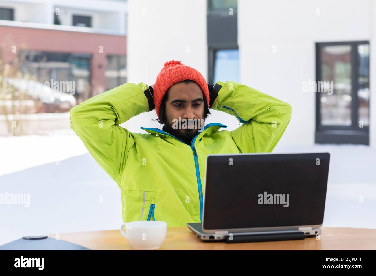 young man working with laptop outside in snow Stock Photo - Alamy