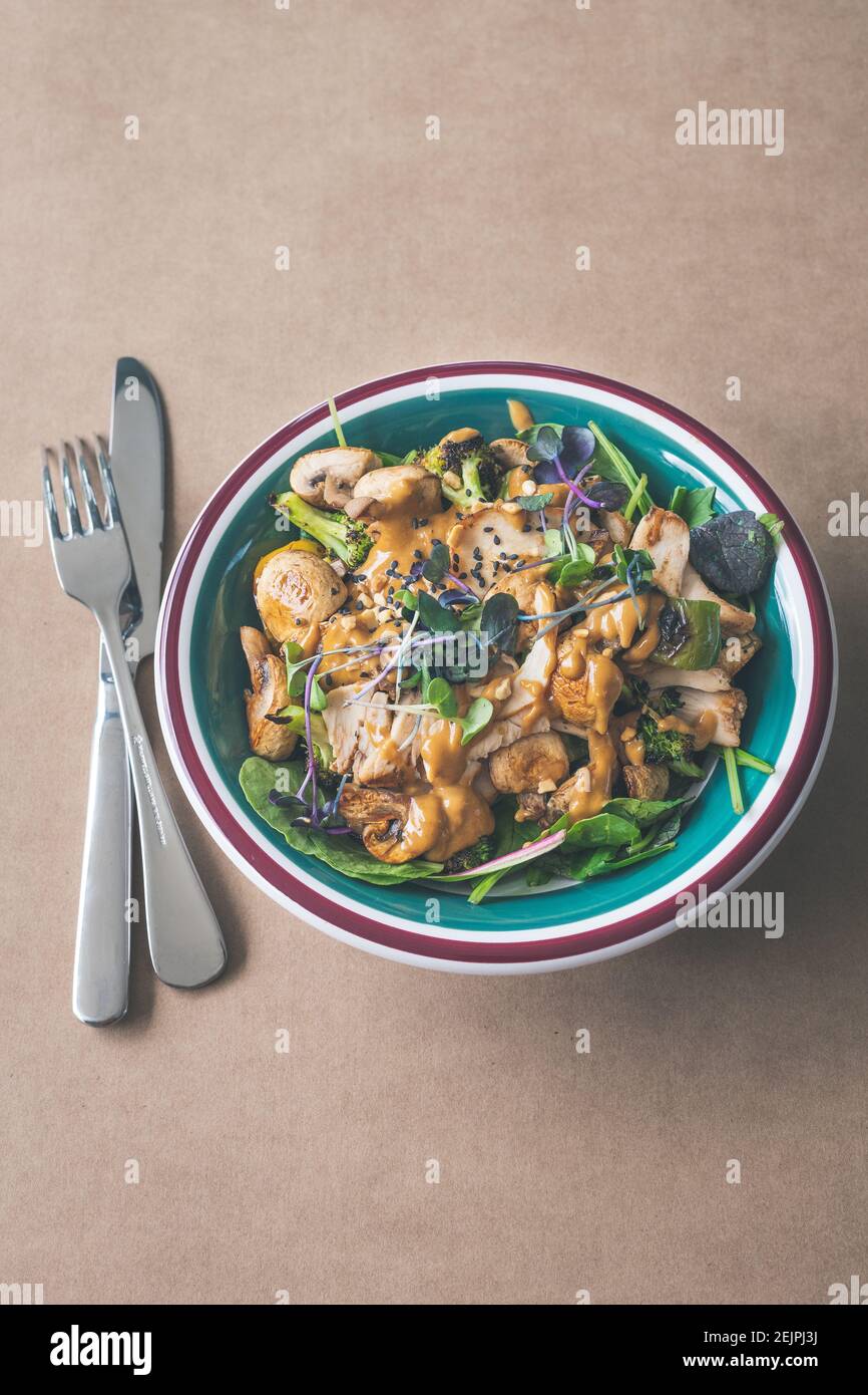Chicken satay salad on craft paper background Stock Photo - Alamy