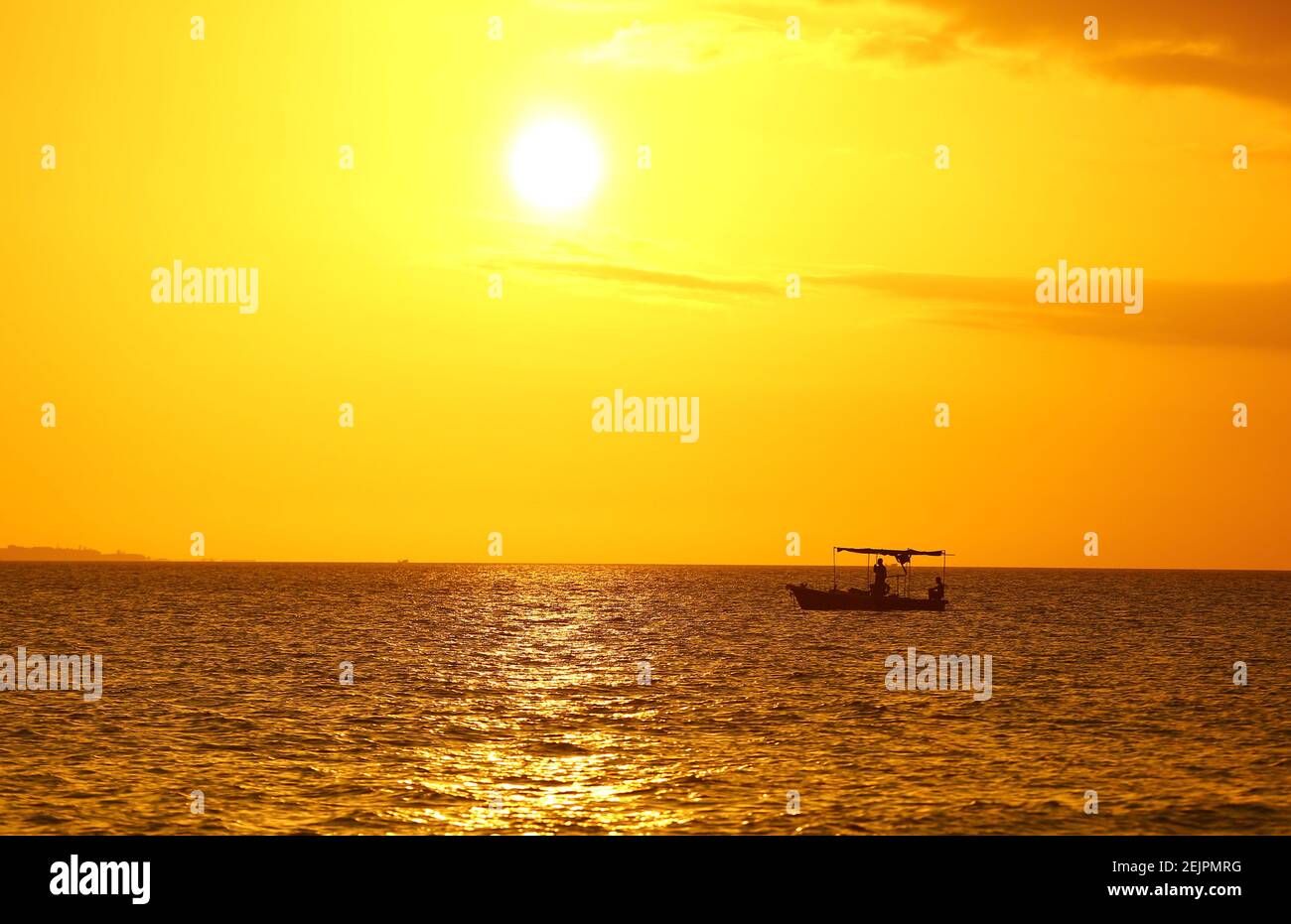 The view of seaside beach at sunset, where tourists enjoy the wonderful ...