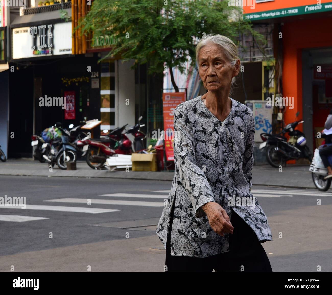 Saigon Old lady Stock Photo - Alamy