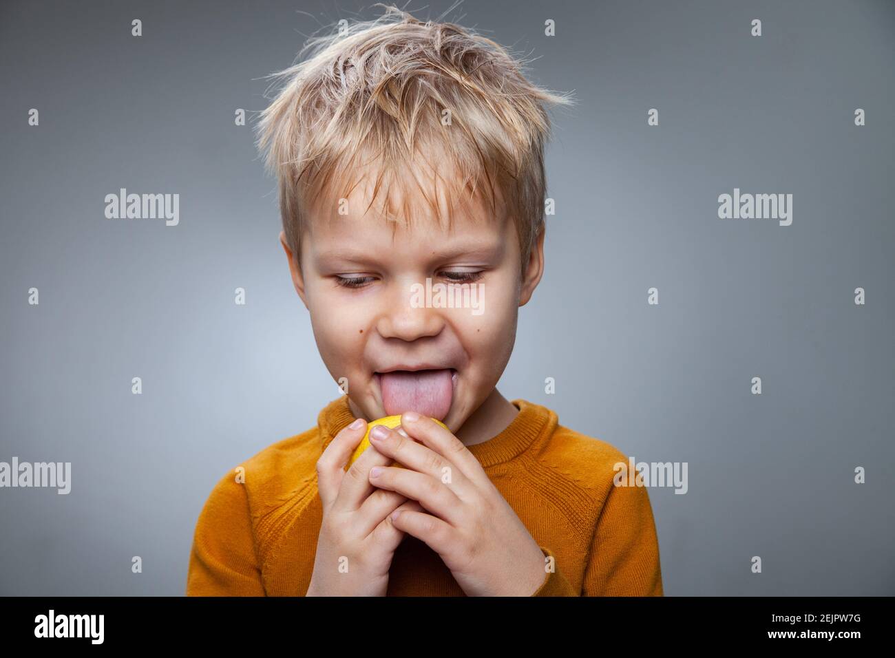 Child eating fruit studio hi-res stock photography and images - Alamy