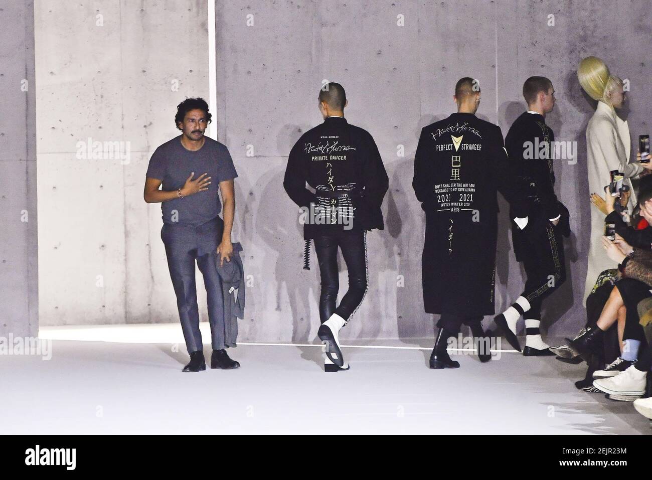 Designer Haider Ackermann walks on the runway at the Haider Ackerman ...