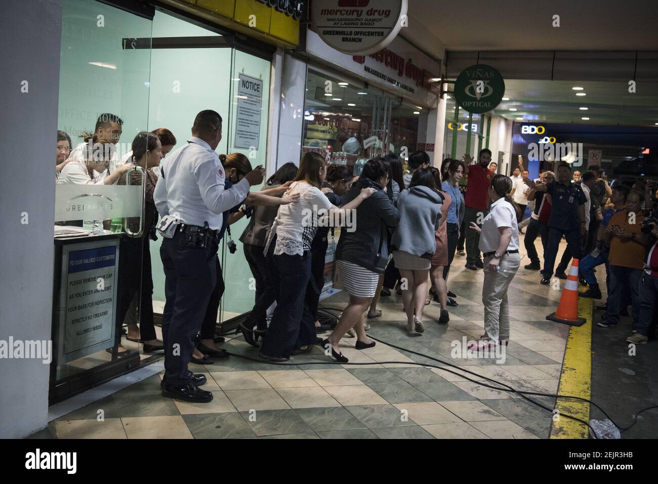 Hostages are being led out of V shopping mall alongside hostage taker ...