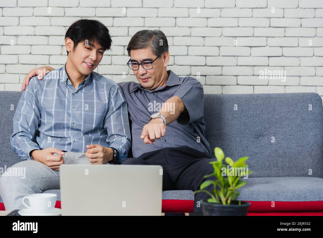 Asian senior businessman with laptop computer discuss together with ...