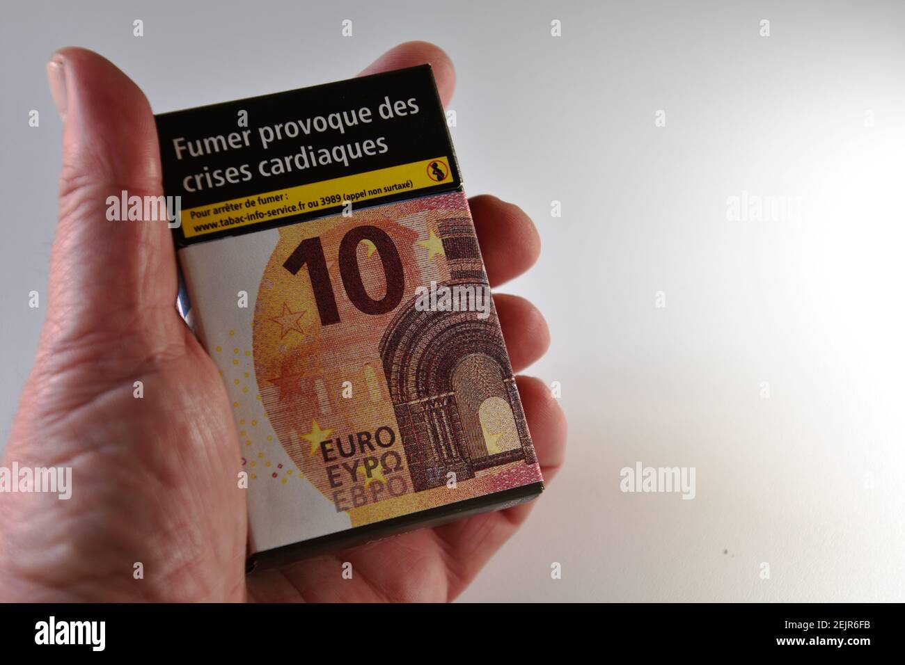 In this photo illustration a pack of cigarettes customised as a 10 euro ...