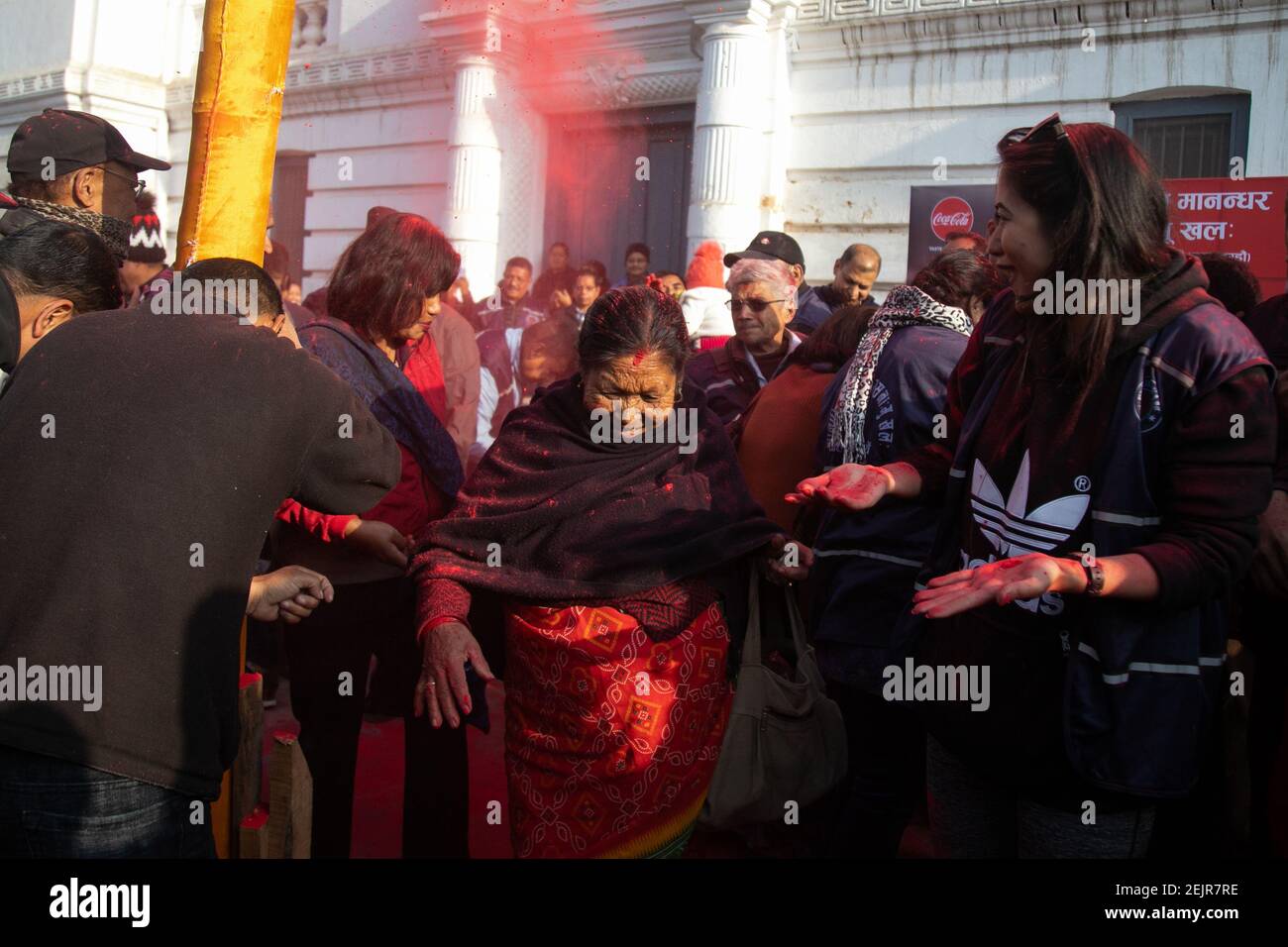 People throw vermilion powder during the festival. The Holi festival ...