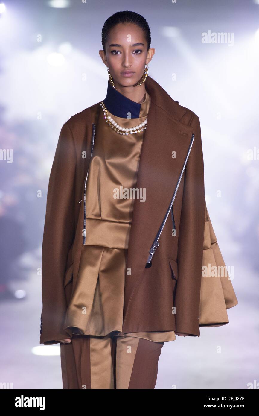 Model Mona Tougaard walks on the runway at the Sacai fashion show ...