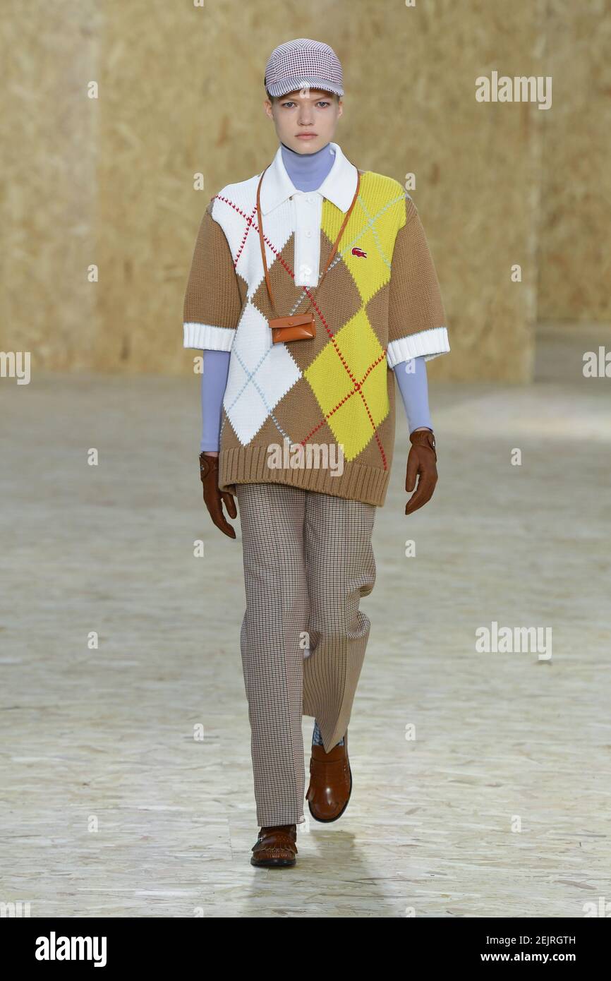 Model Madeleine Fischer walks on the runway at the Lacoste fashion show ...