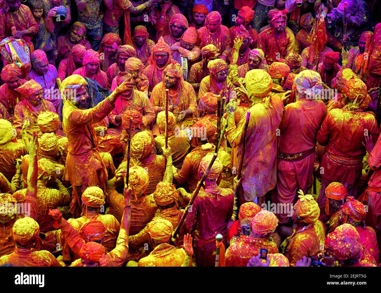 Hindu devotees sit together at Radharani Temple of Nandgaon in Mathura ...