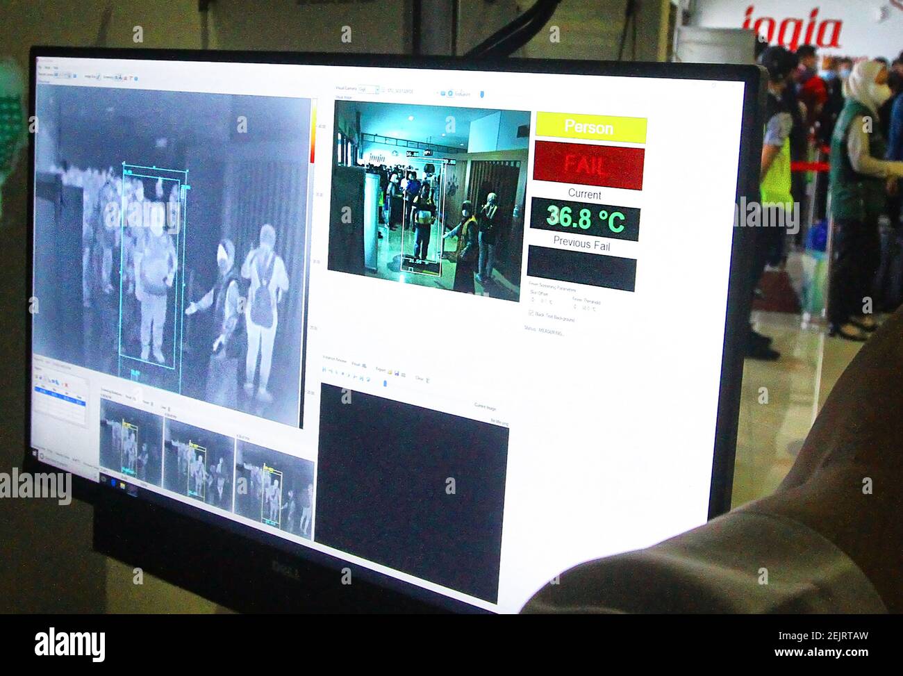 Health Officers use thermal scanners to monitor the body temperature of ...