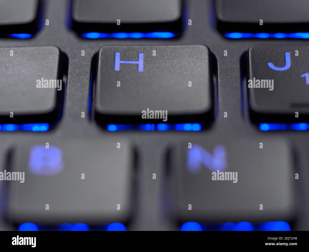 Closeup laptop blue lighted keyboard Stock Photo - Alamy